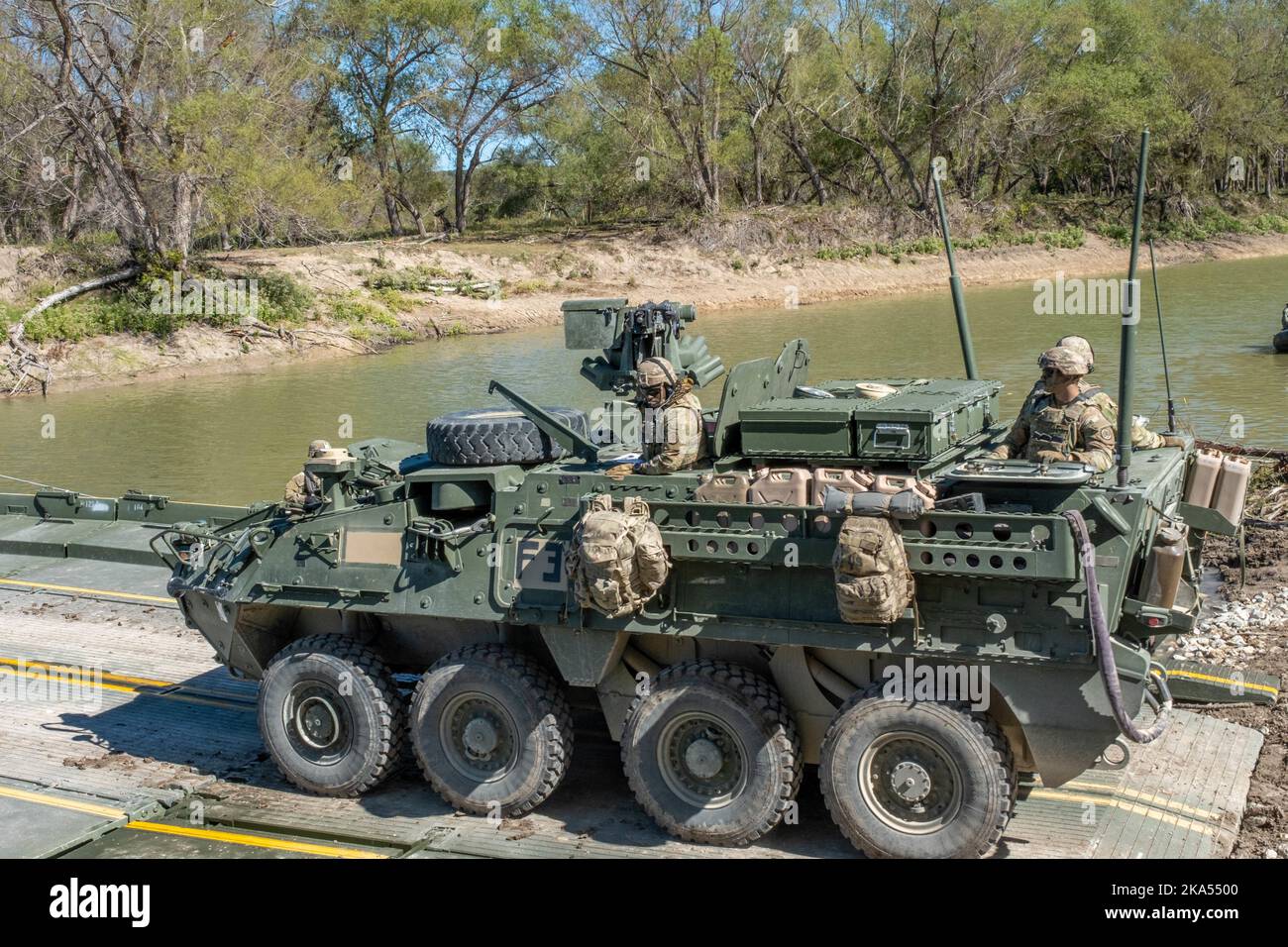An M1126 Stryker Combat Vehicle crosses an improved ribbon bridge ...