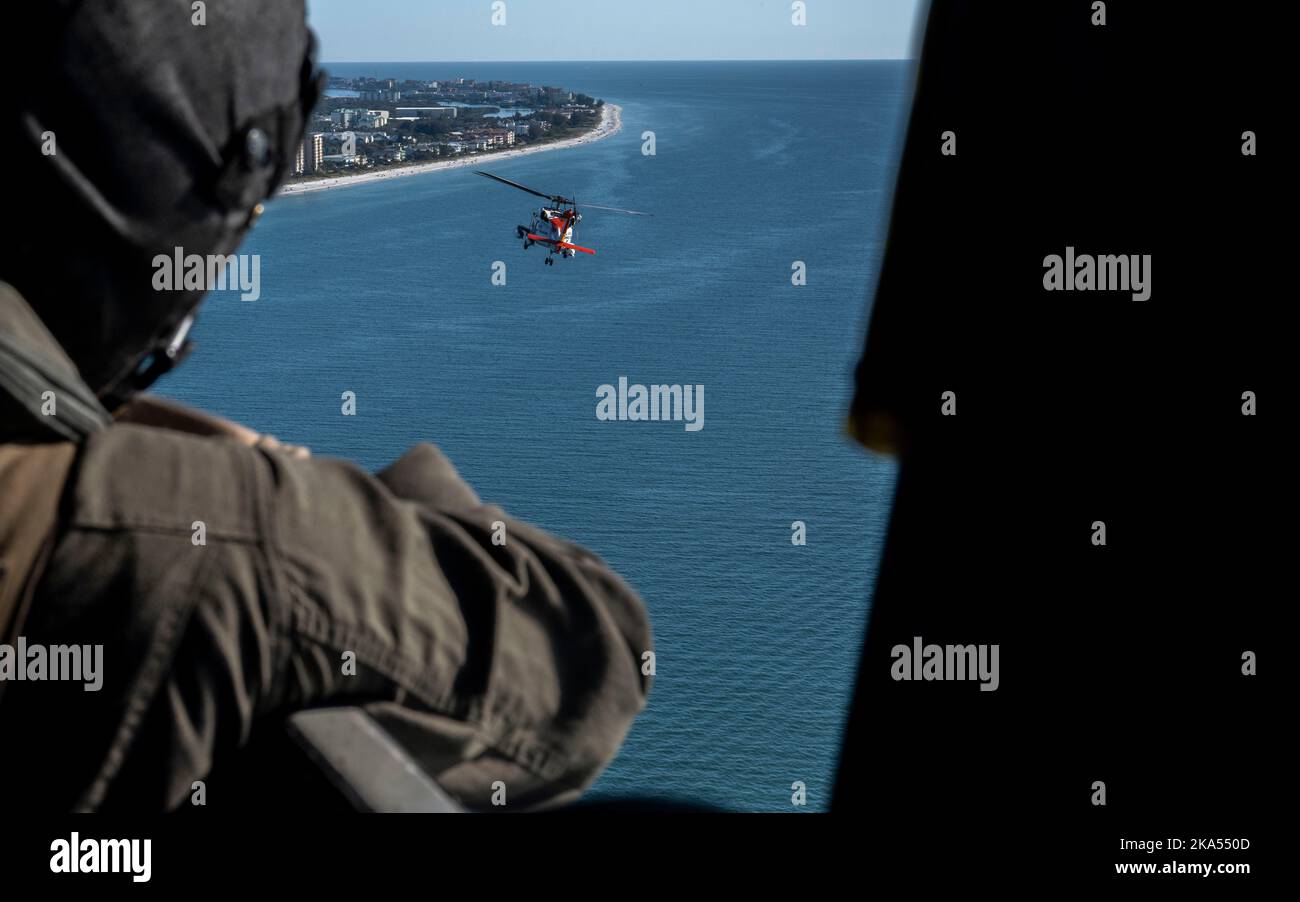 A U.S. Coast Guard MH-60T Jayhawk, flies over Clearwater, Florida ...