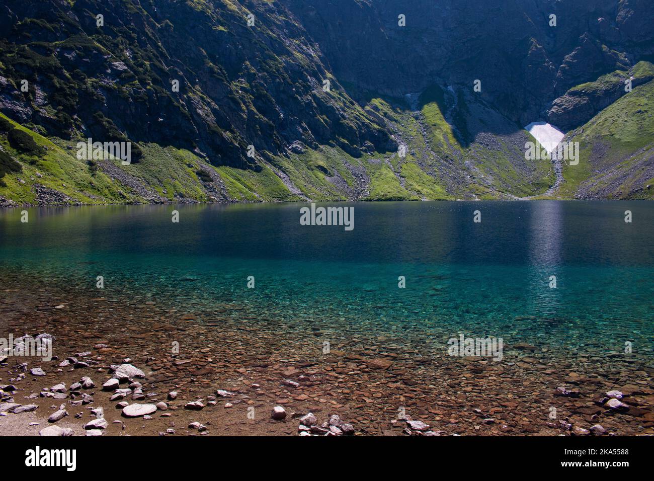 Azure water of Czarny Staw pod Rysamy or Black Pond lake near the ...
