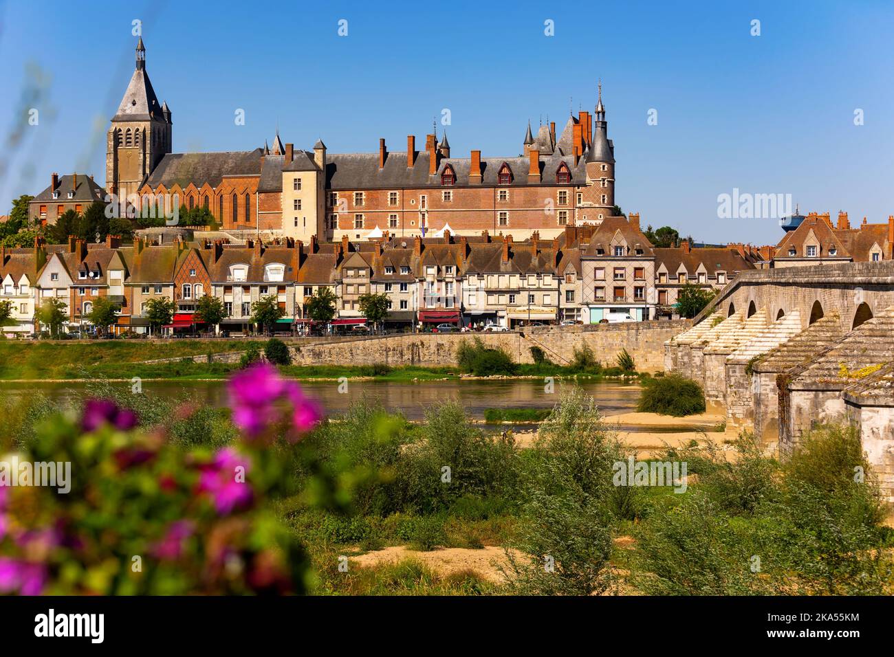 View of Gien with the castle and the old bridge across Loire river ...