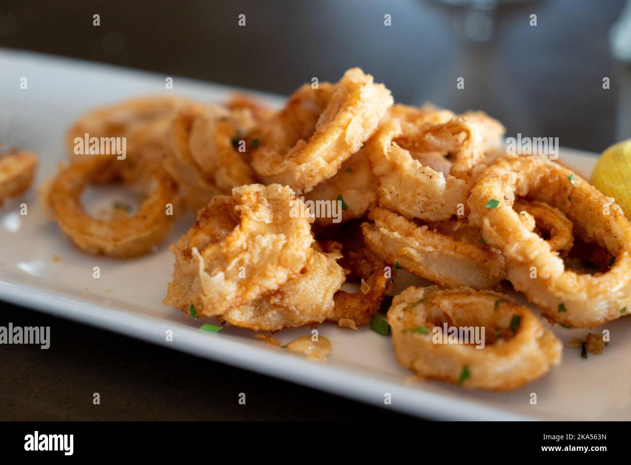 Italian style fried calamari on white plate Stock Photo - Alamy