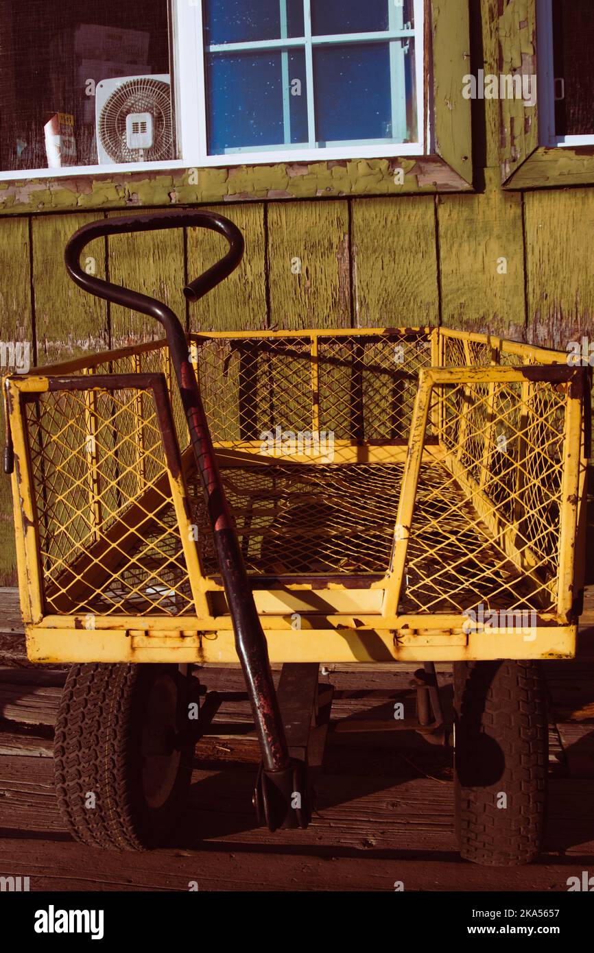 metal wire carts parked next to the outside wall, and wood boardwalk ...