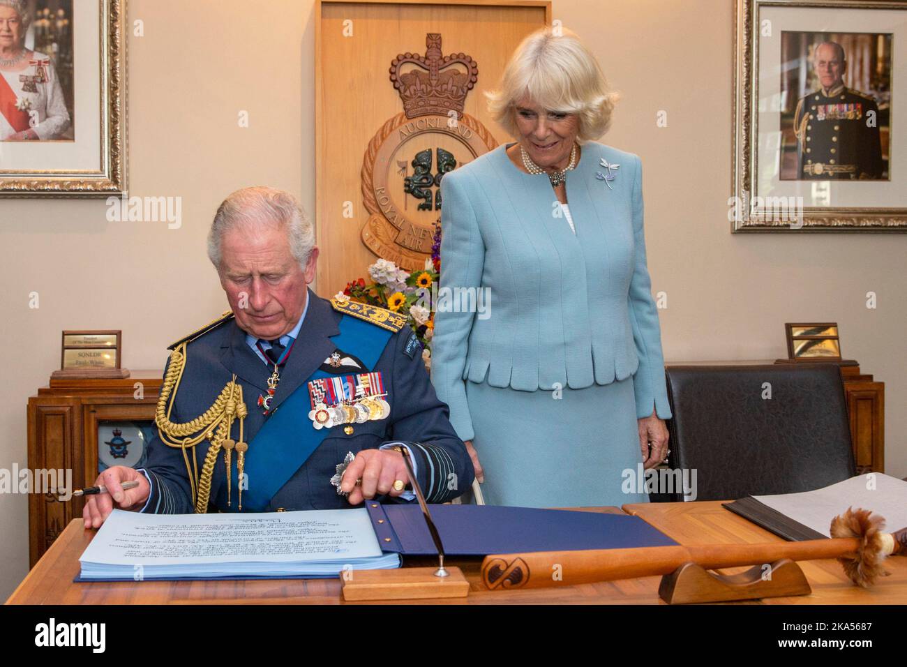 Prince Charles and Camilla, Duchess of Cornwall sign the visitors book ...