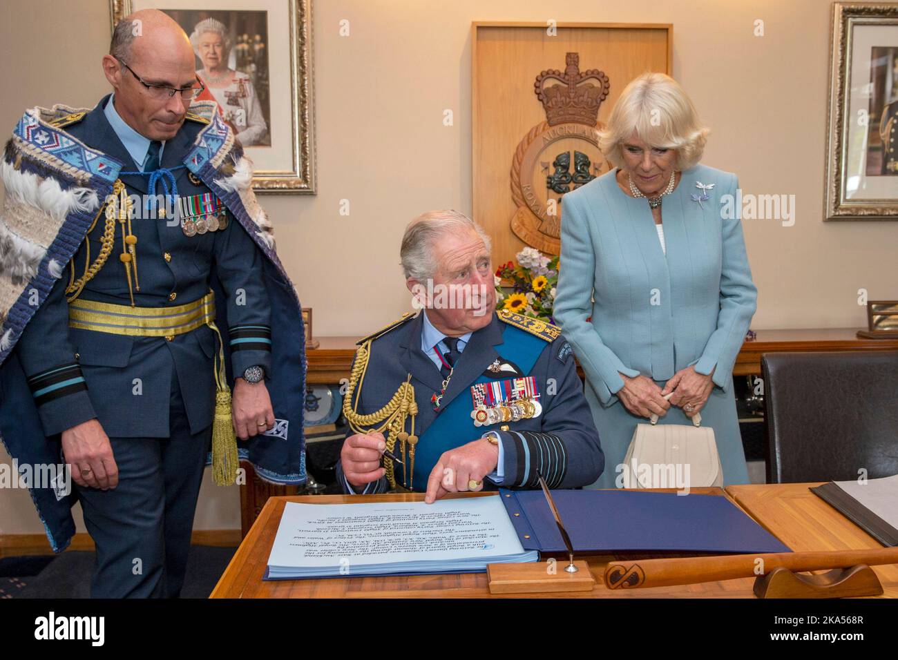Prince Charles and Camilla, Duchess of Cornwall sign the visitors book ...