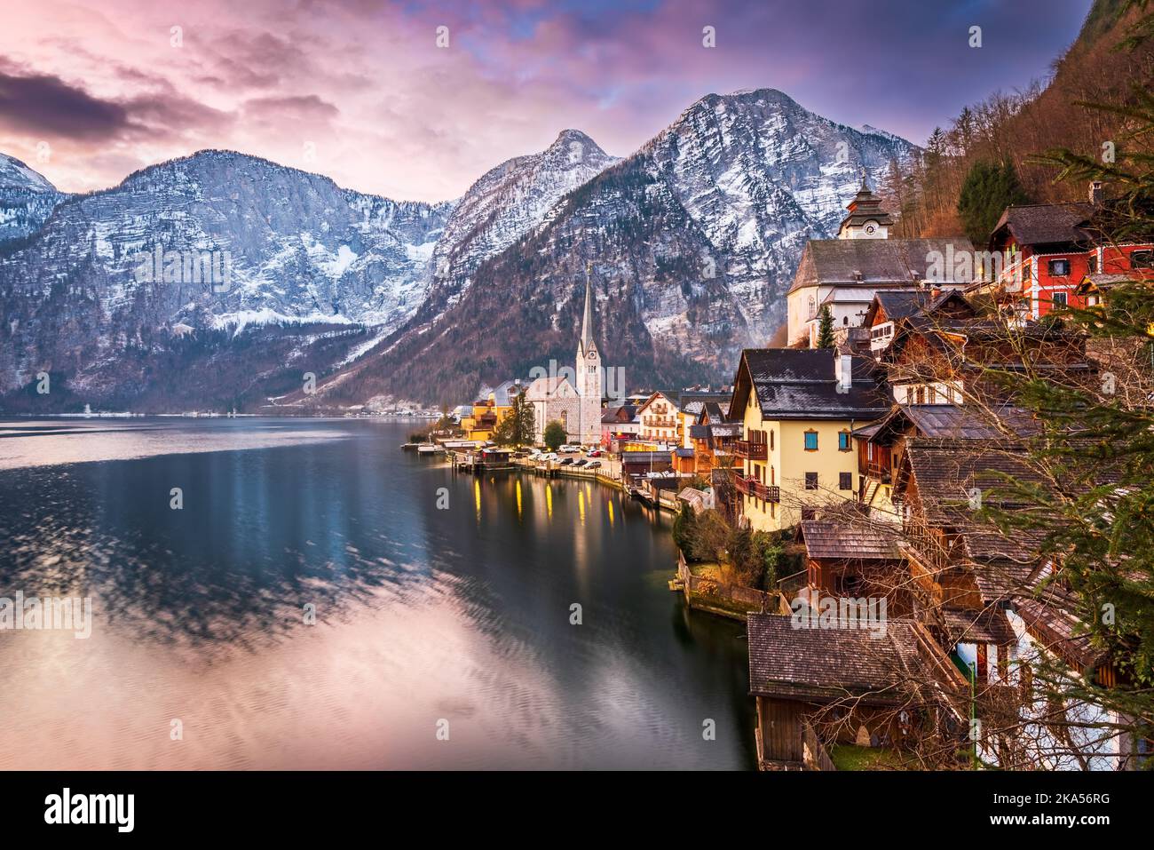 Hallstatt, Austria - Colored sunrise postcard view of famous Alps mountain village in ...