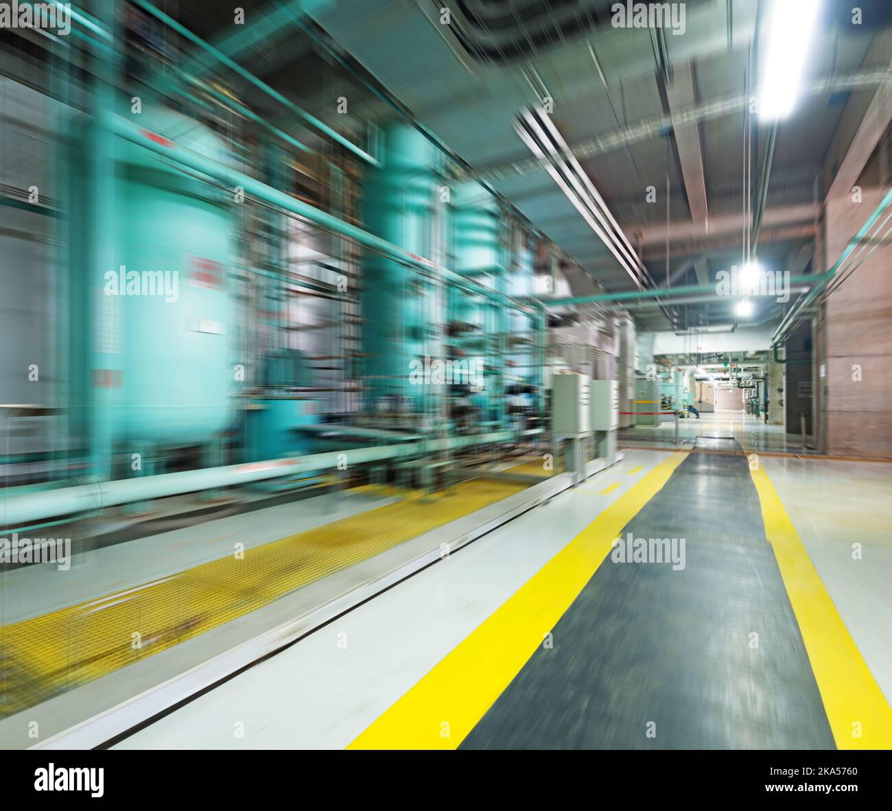 Equipment, cables and piping as found inside of industrial power plant ...