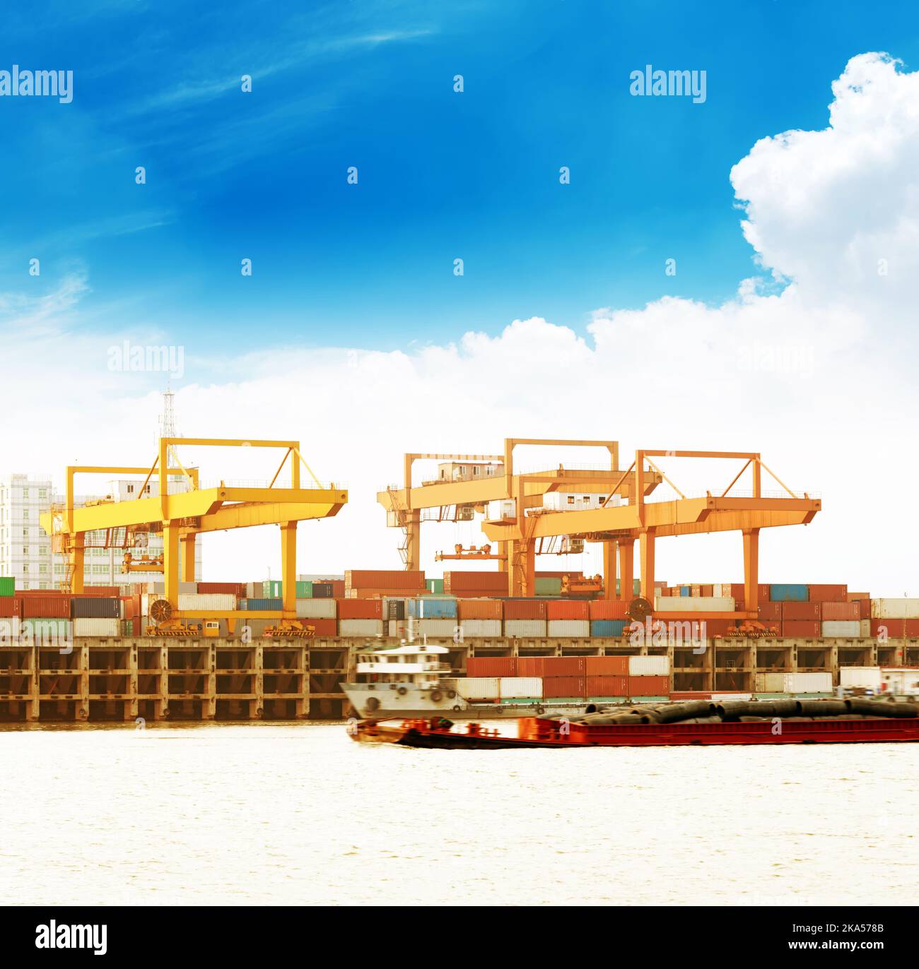 Large container ship in a dock at port Stock Photo - Alamy