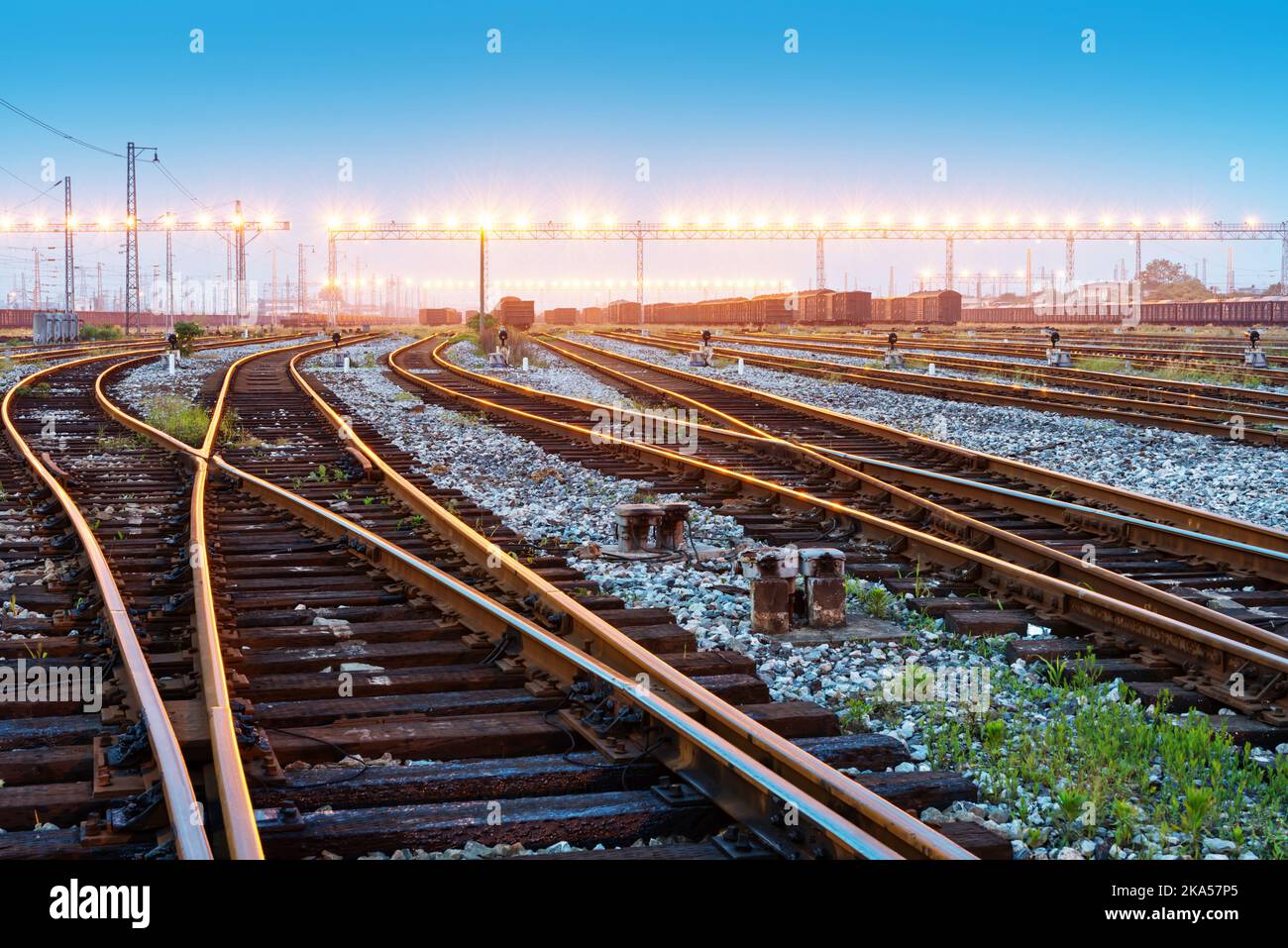 Cargo train platform at sunset with container Stock Photo - Alamy