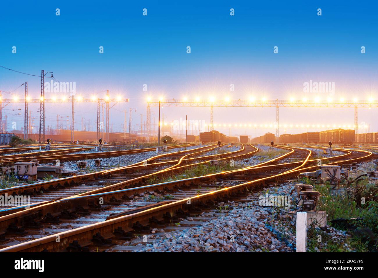 Cargo train platform at sunset with container Stock Photo - Alamy