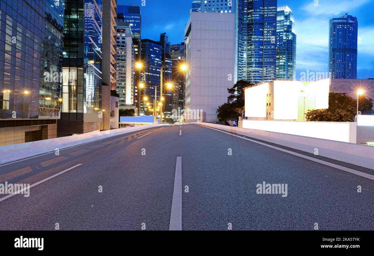Asphalt road and modern city Stock Photo - Alamy
