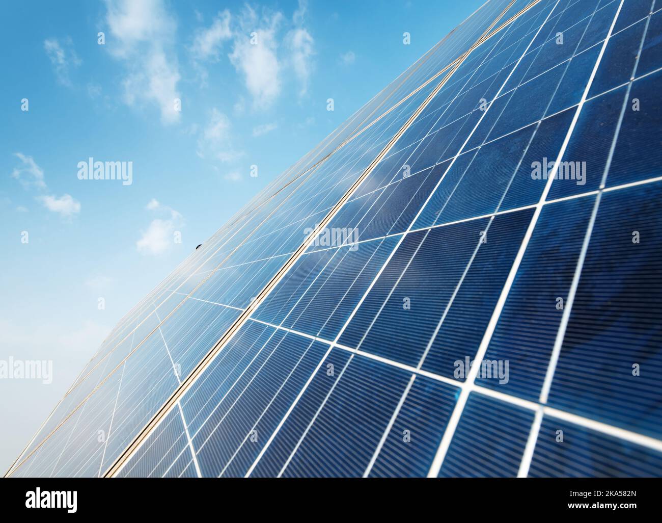 Solar panels against blue sky Stock Photo - Alamy