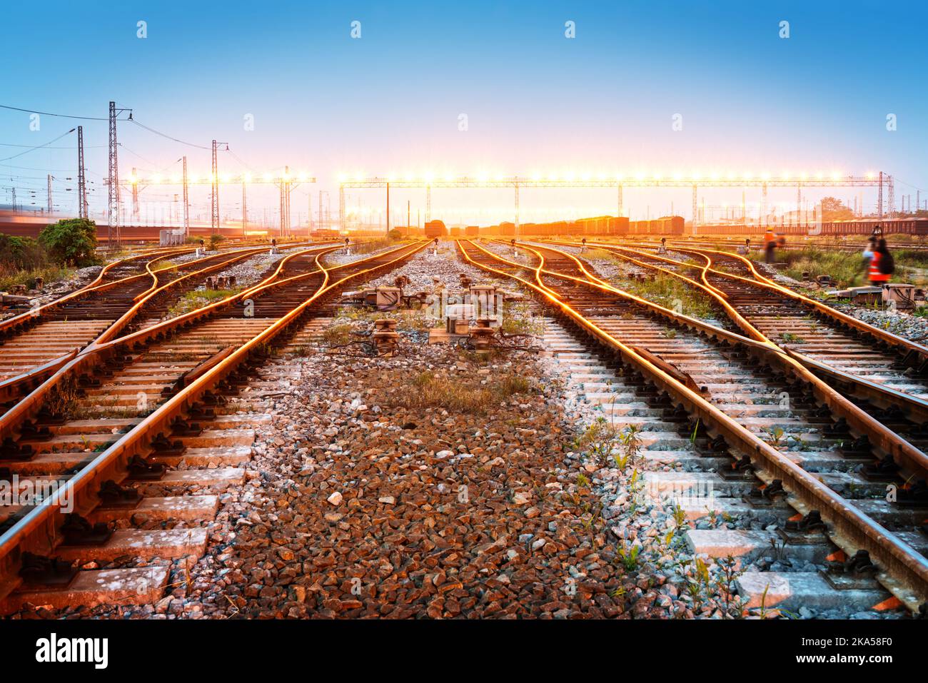 Cargo train platform at sunset with container Stock Photo - Alamy