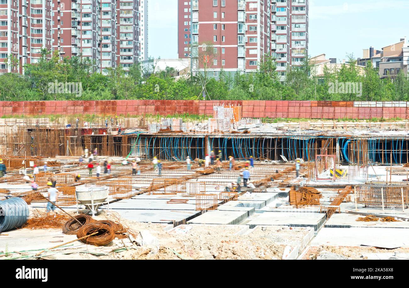 building under construction with workers Stock Photo - Alamy
