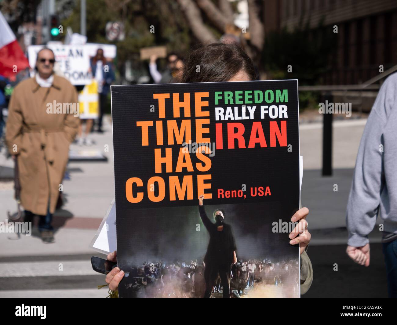 A protester holds a placard expressing their opinion during a ...
