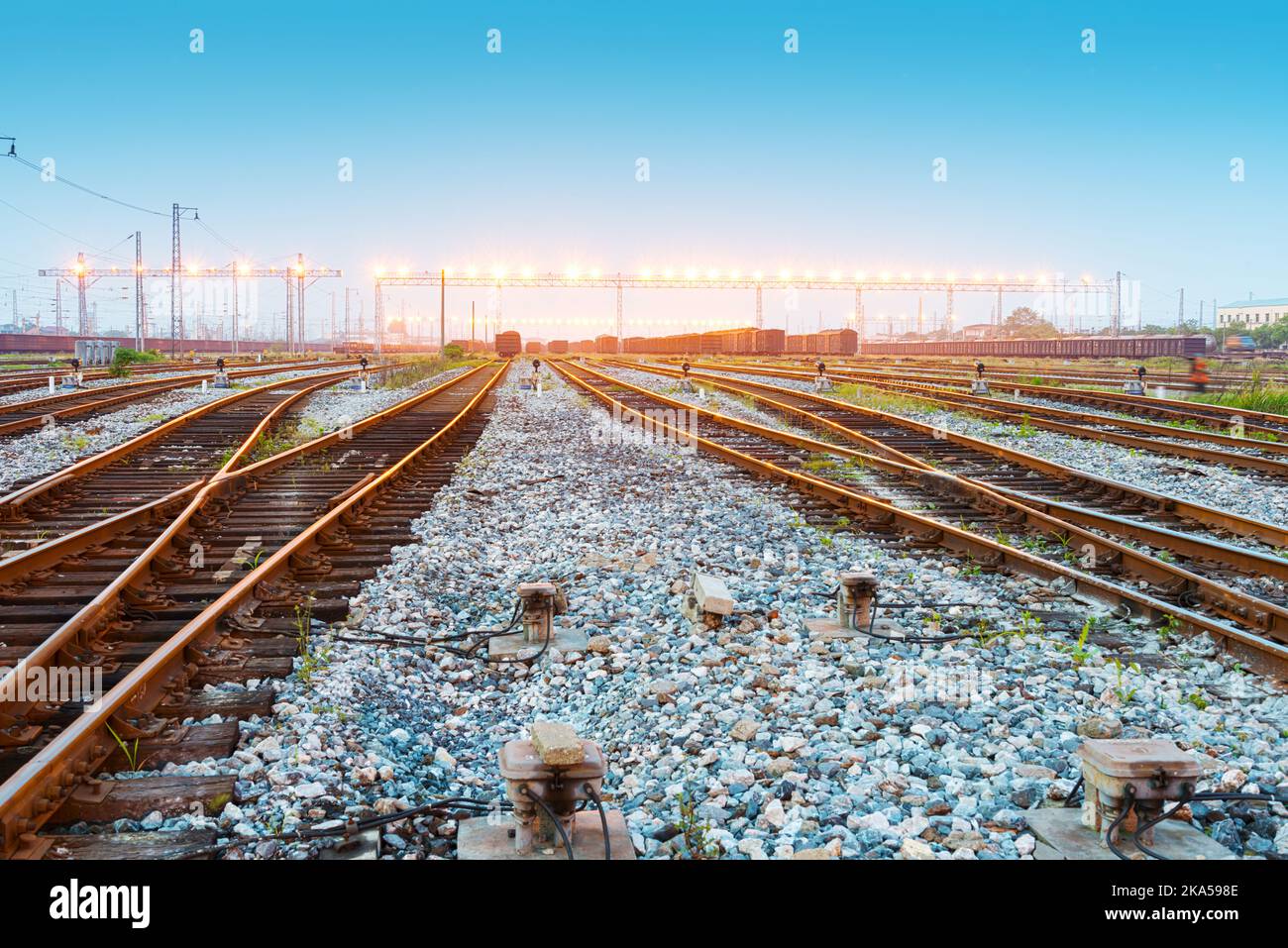Cargo train platform at sunset with container Stock Photo - Alamy