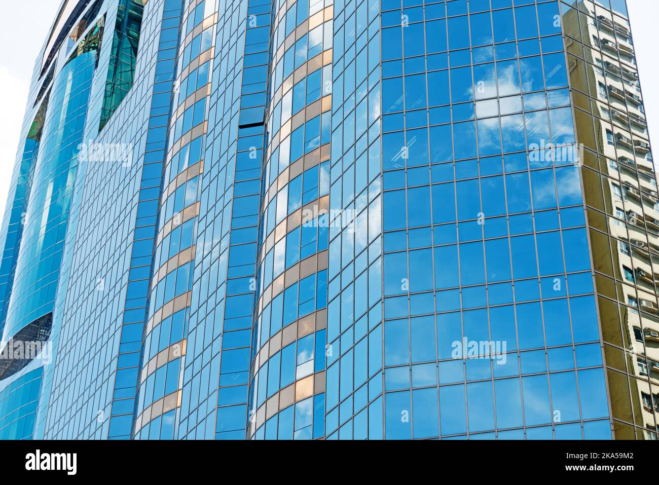 Cloudy sky reflected in the windows of skyscraper urban background hi ...