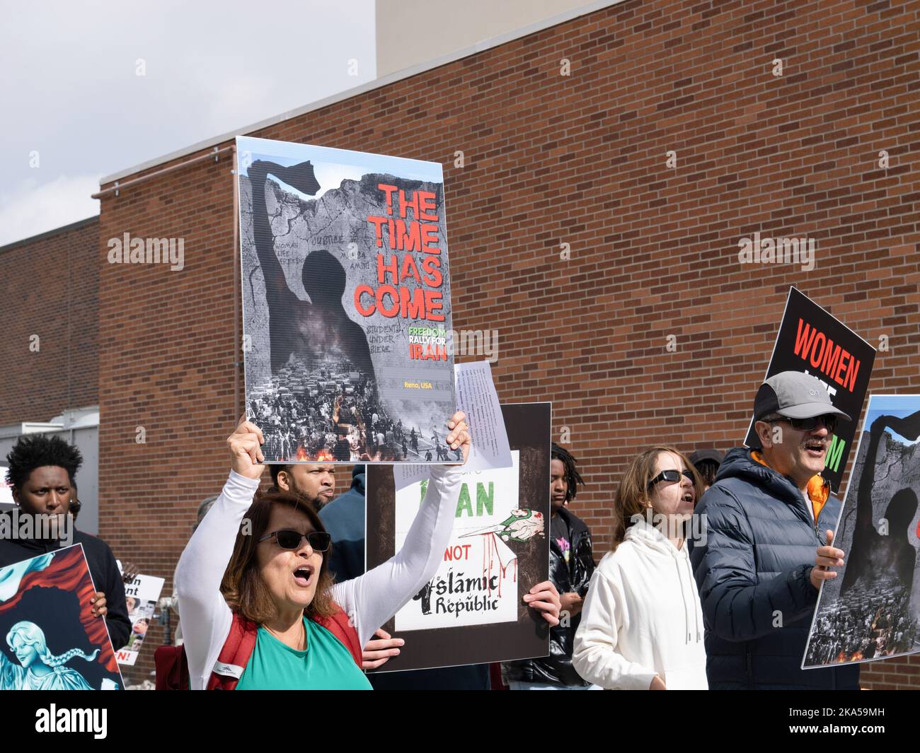 Reno, Nevada, USA. 22nd Oct, 2022. Protesters hold placards and chant ...