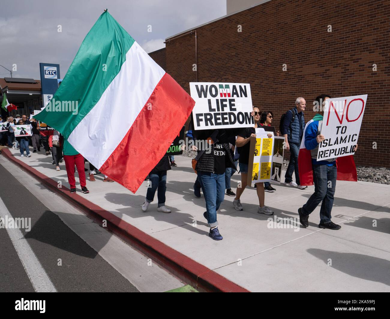 Reno, Nevada, USA. 22nd Oct, 2022. Protesters carry an Iranian flag and ...