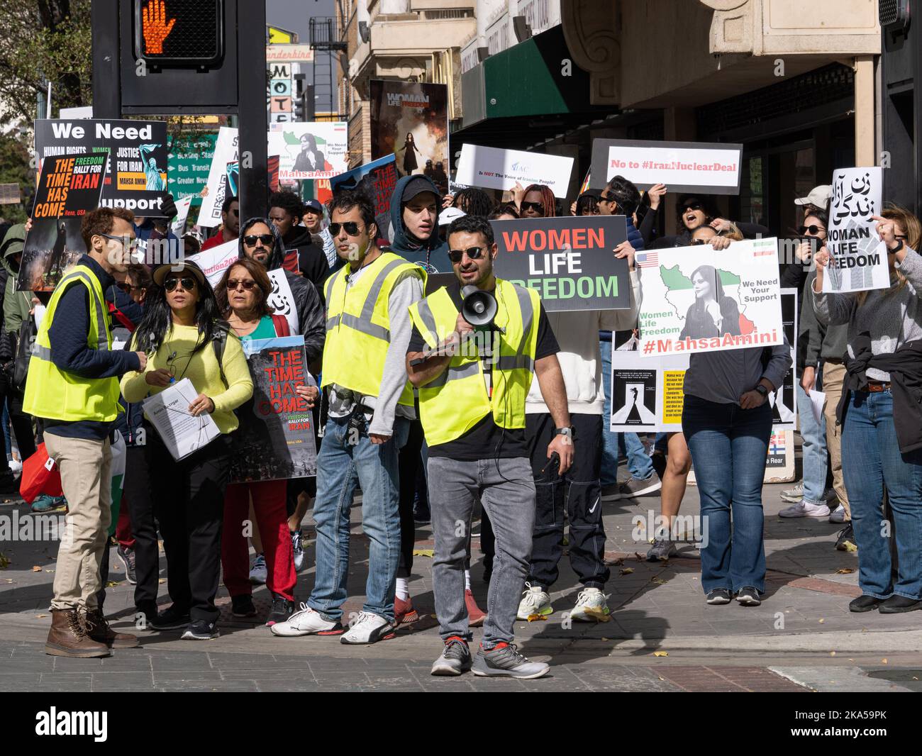 Reno, Nevada, USA. 22nd Oct, 2022. Protesters hold placards and chant ...