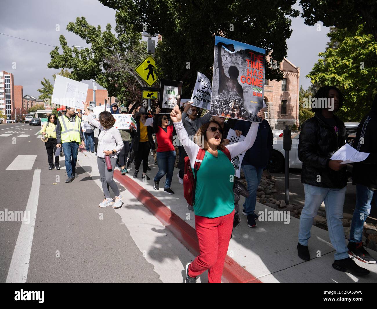 Reno, Nevada, USA. 22nd Oct, 2022. Protesters hold placards and chant ...