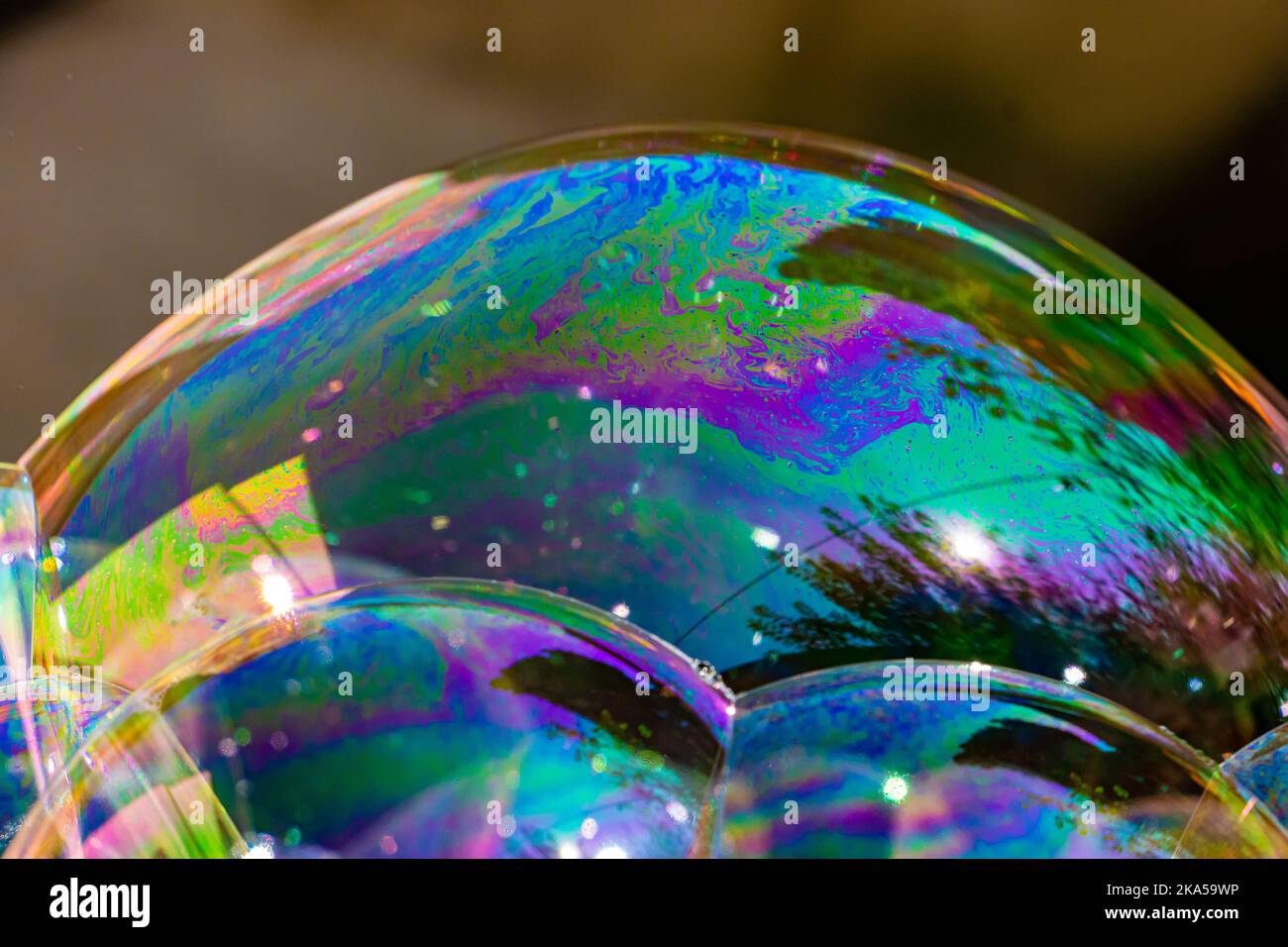 Colorful soap bubbles with a big bubble Stock Photo - Alamy
