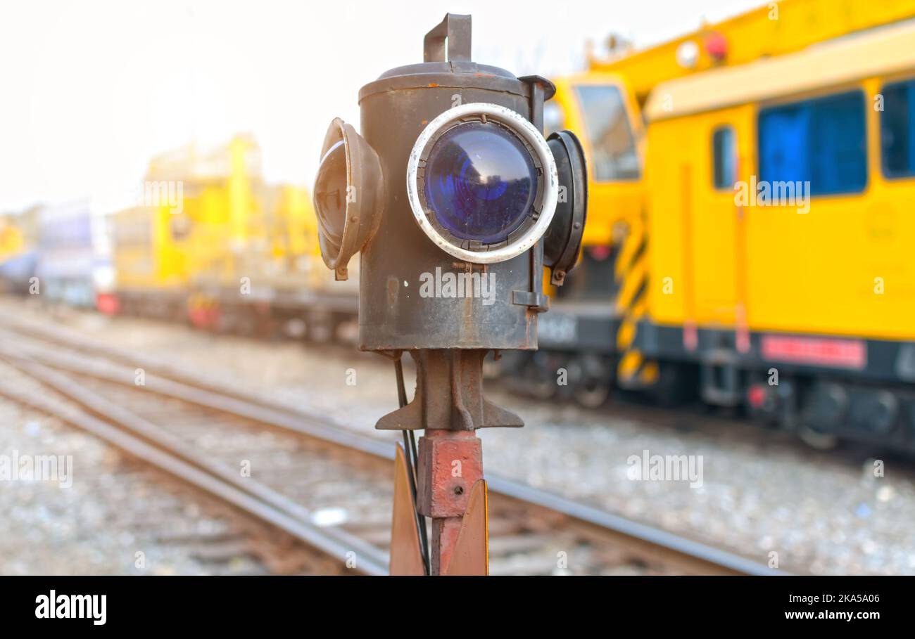 Traffic light shows blue signal on railway Stock Photo - Alamy