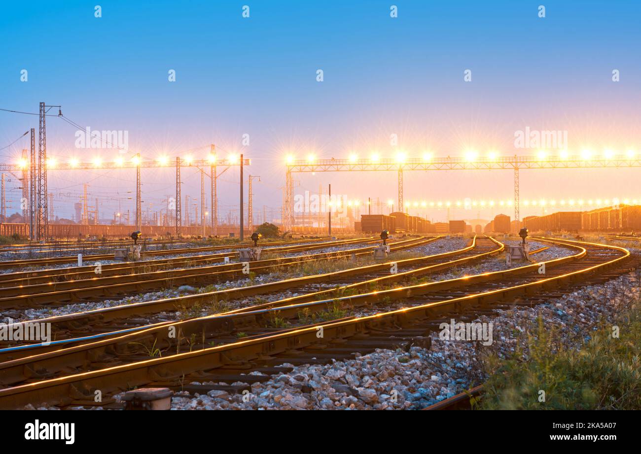 Cargo train platform at sunset with container Stock Photo - Alamy