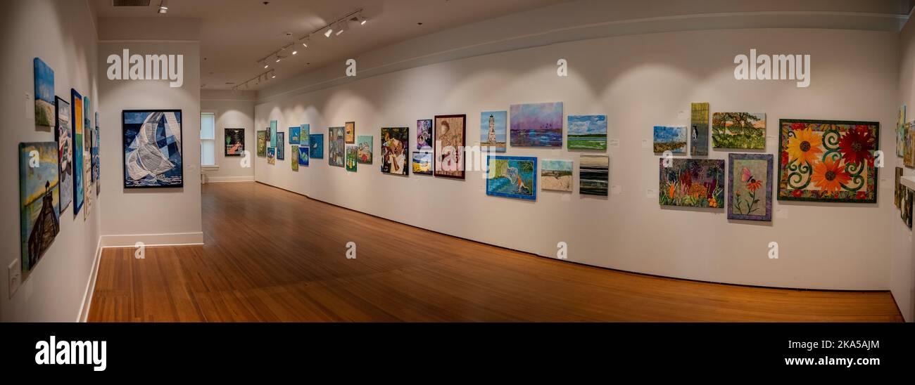 A panoramic view of a museum exhibit showcasing modern illustrative ...