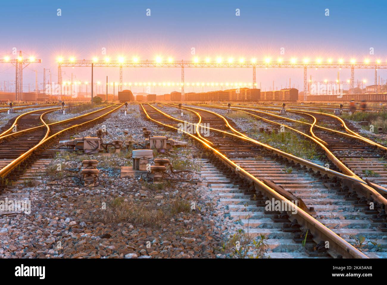 Cargo train platform at sunset with container Stock Photo - Alamy