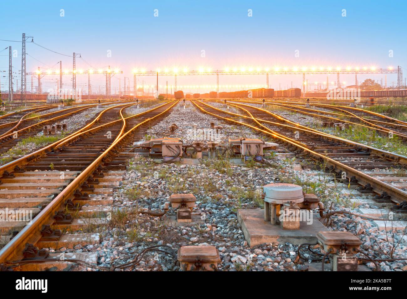 Cargo train platform at sunset with container Stock Photo - Alamy
