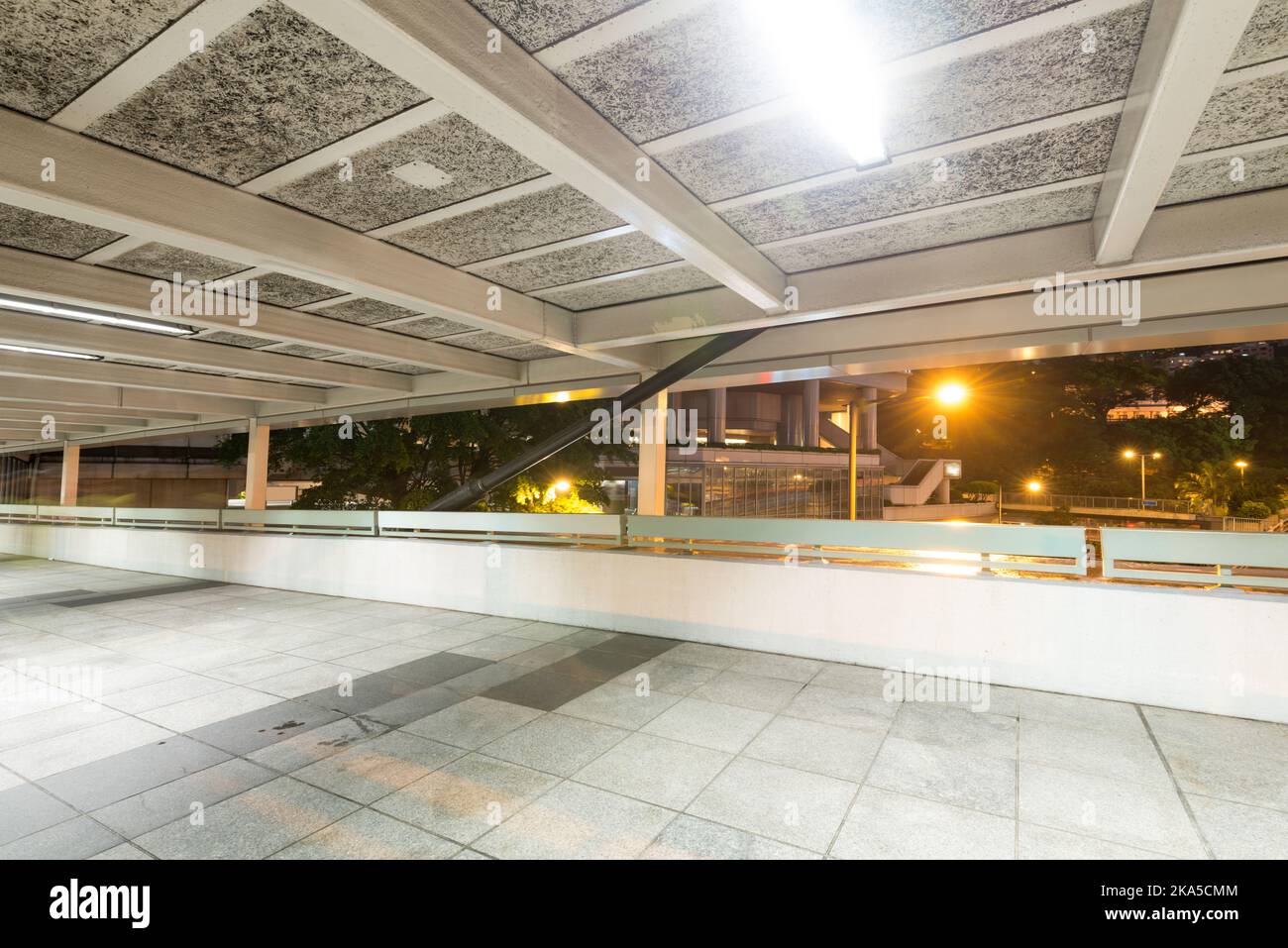 Covered walkway over railway tracs Stock Photo - Alamy