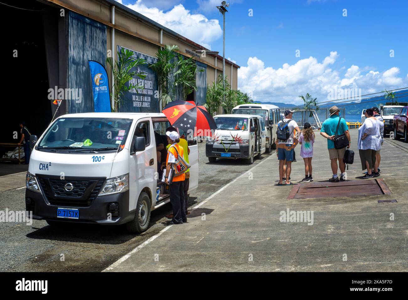 Tour buses waiting for passengers from a cruise ship, Alotau, Milne Bay ...