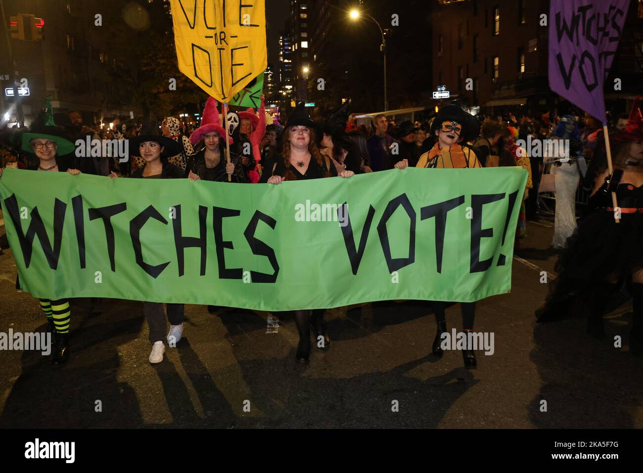 New York, New York/ USA – 31 Oct 2022:A group of witches carry a banner ...