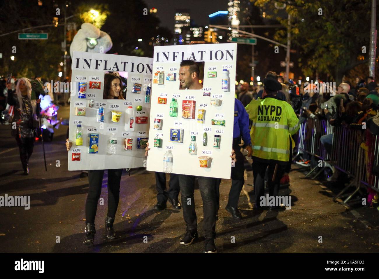New York, New York, USA. 31st Oct, 2022. Inflation costume revelers of ...