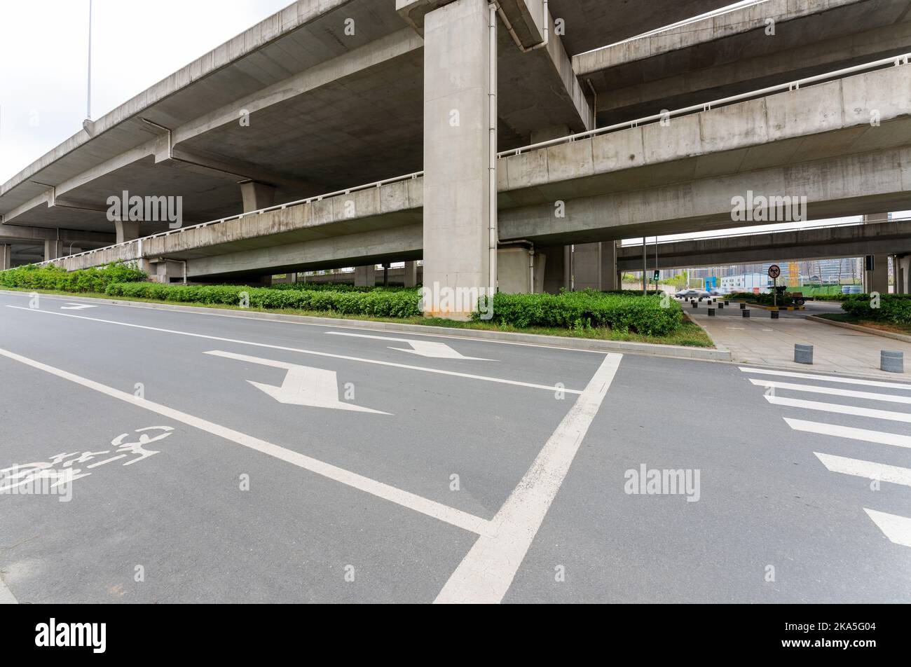 Concrete structure and asphalt road space under the overpass in the ...