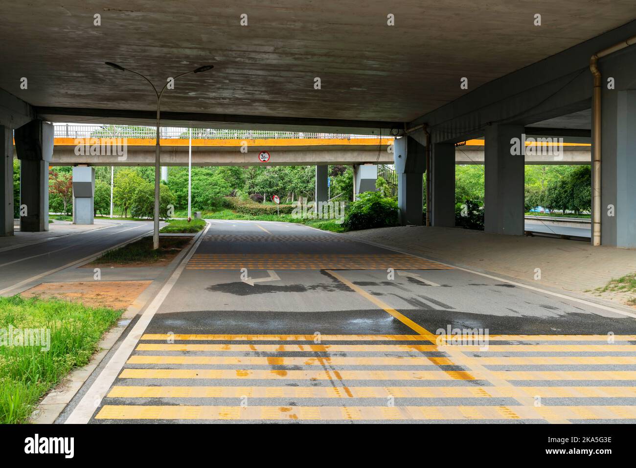 Concrete structure and asphalt road space under the overpass in the ...