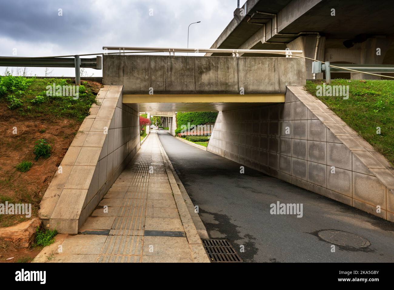 Concrete structure and asphalt road space under the overpass in the ...