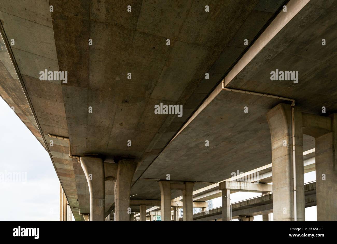 Concrete structure and asphalt road space under the overpass in the ...