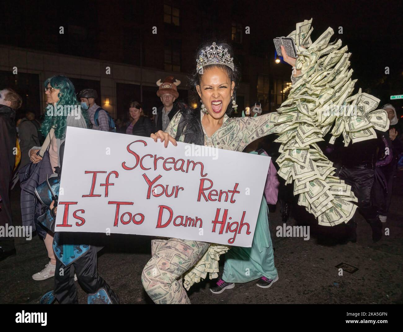 NEW YORK, N.Y. – October 31, 2022: Costumed marchers are seen at the ...
