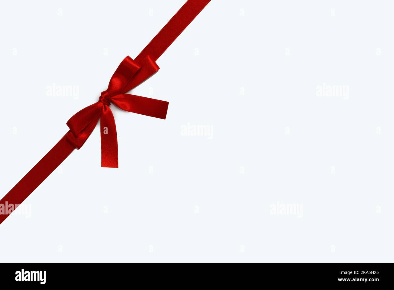 Elegant satin red ribbon bow isolated on white background Stock Photo ...