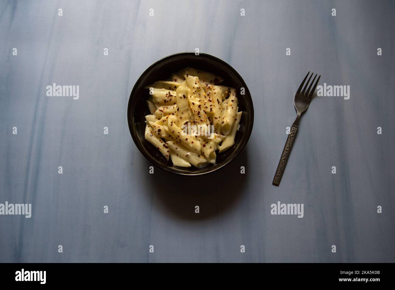 Pasta with cheese sauce and mushrooms hi-res stock photography and ...