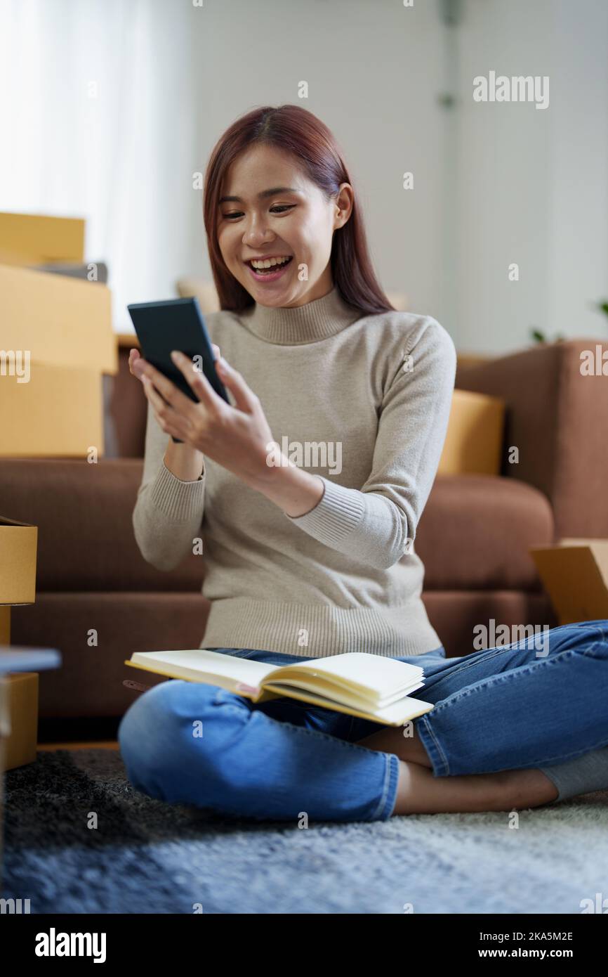 A portrait of a small startup, an SME owner, an Asian female ...