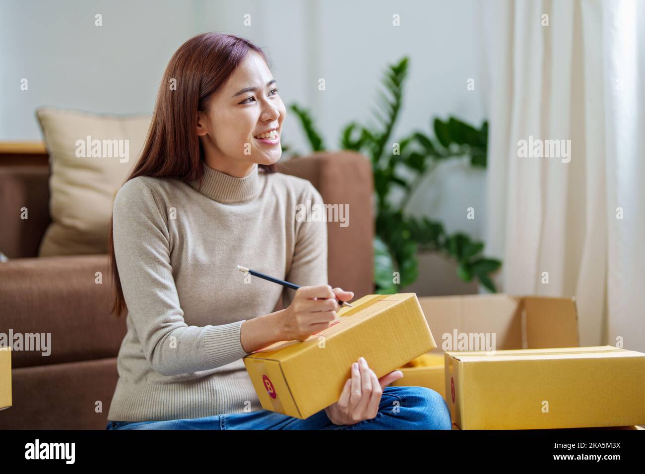 A portrait of a small startup, an SME owner, an Asian female ...