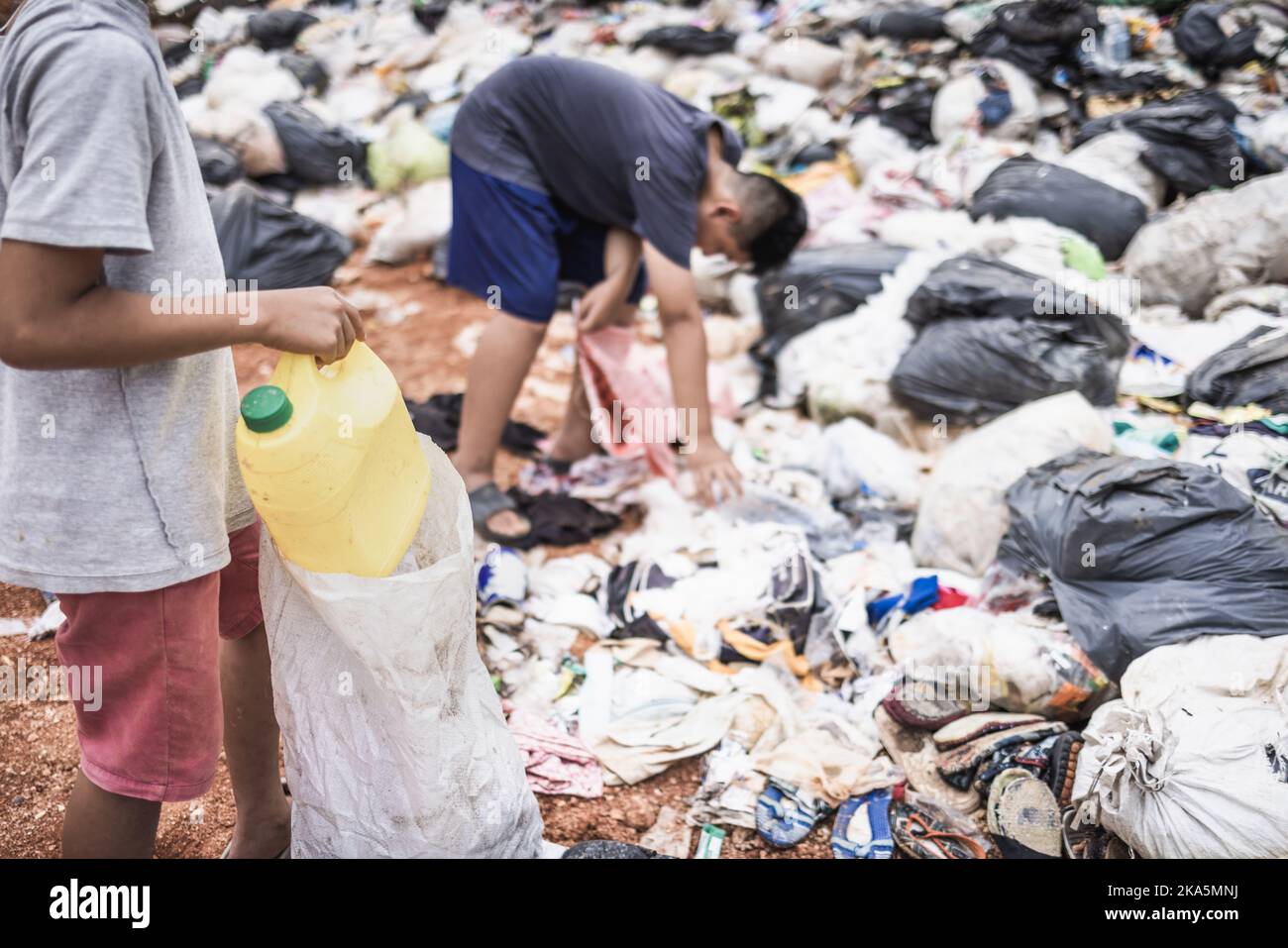 Poor children collect garbage to sell, child labor, poverty Stock Photo ...