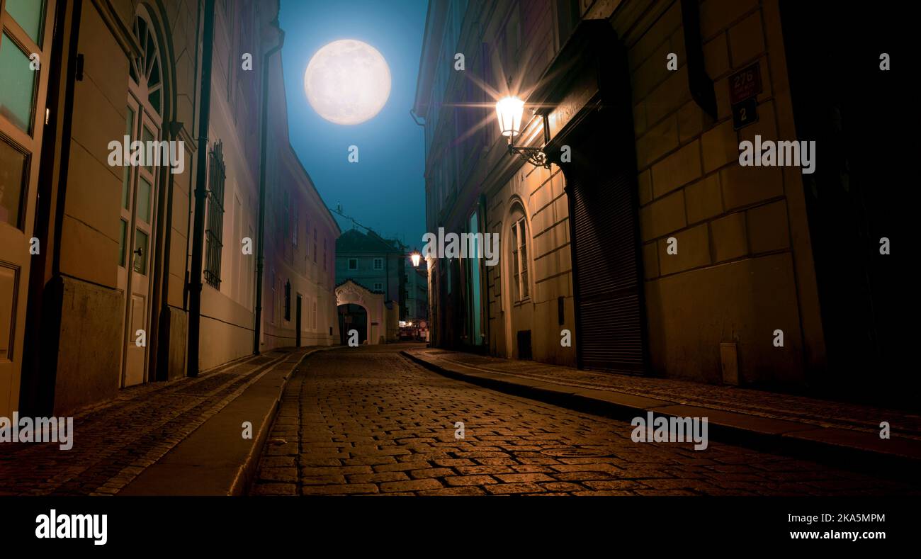 old night street of Prague and the full moon in the night sky Stock ...