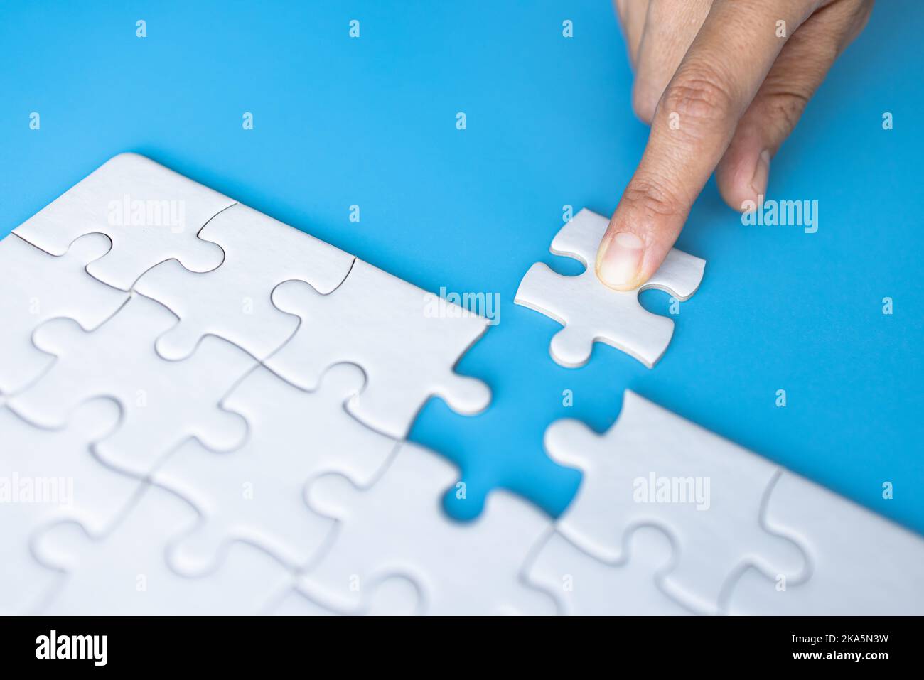 White jigsaw in the hands, The correct solution. Teamwork, Solving and ...