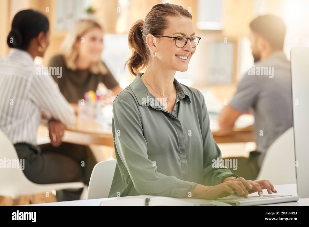 Happy business woman, computer administration and typing email ...