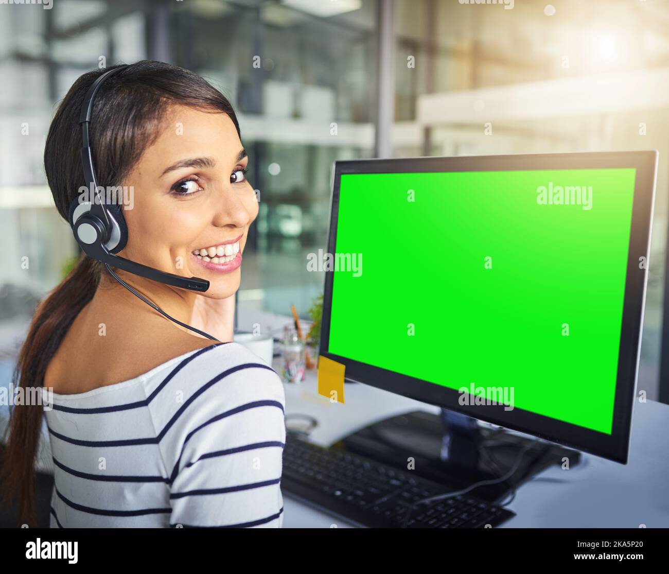 Using technology to help me handle customers. a young attractive female ...