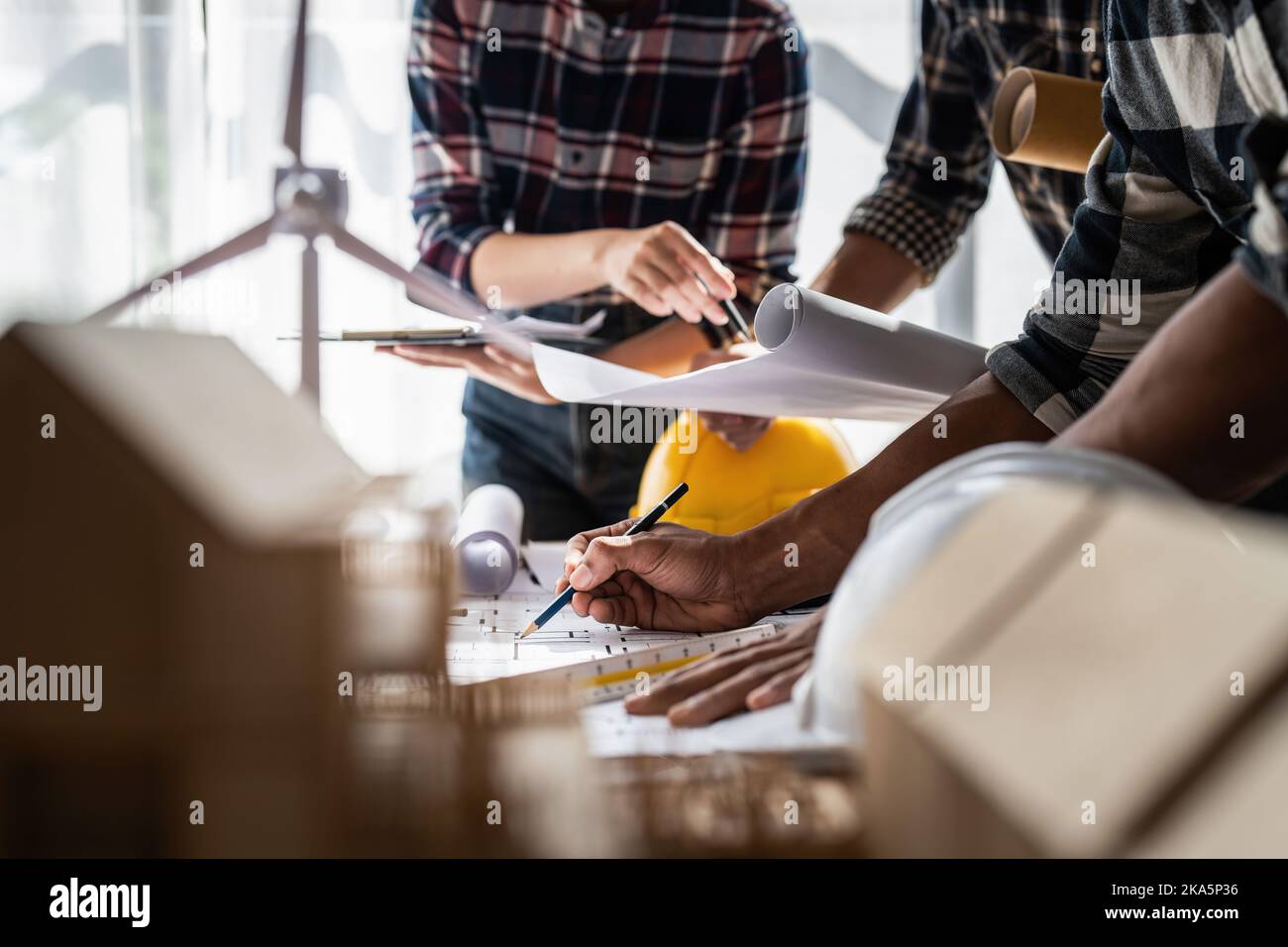 Architect team working with blueprints for architectural plan, engineer ...