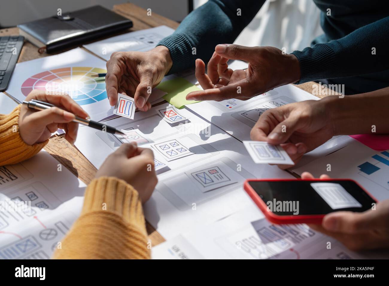 Group of ux developer and ui designer brainstorming about app interface ...